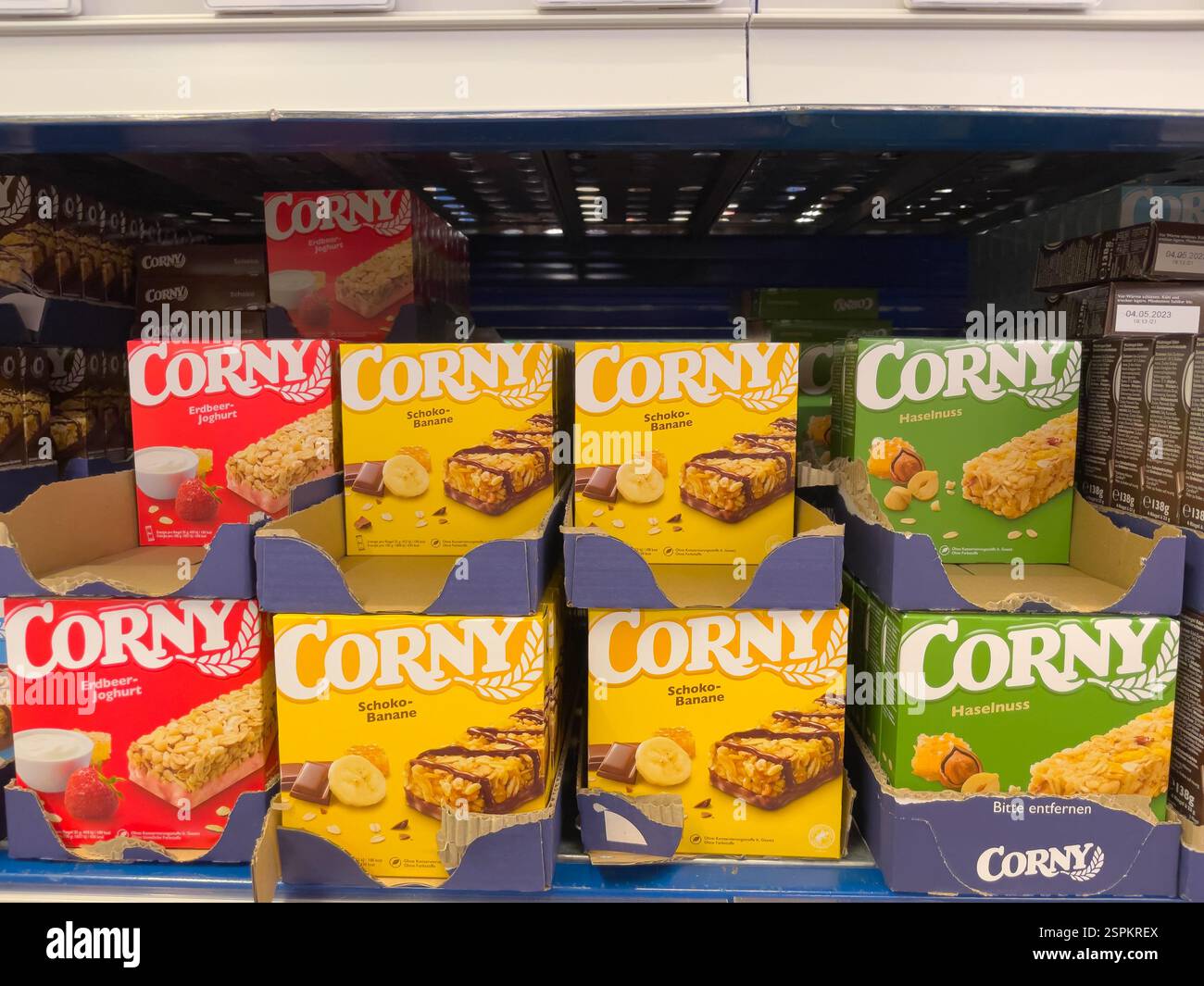 A supermarket shelf displays multiple boxes of Corny cereal bars in ...