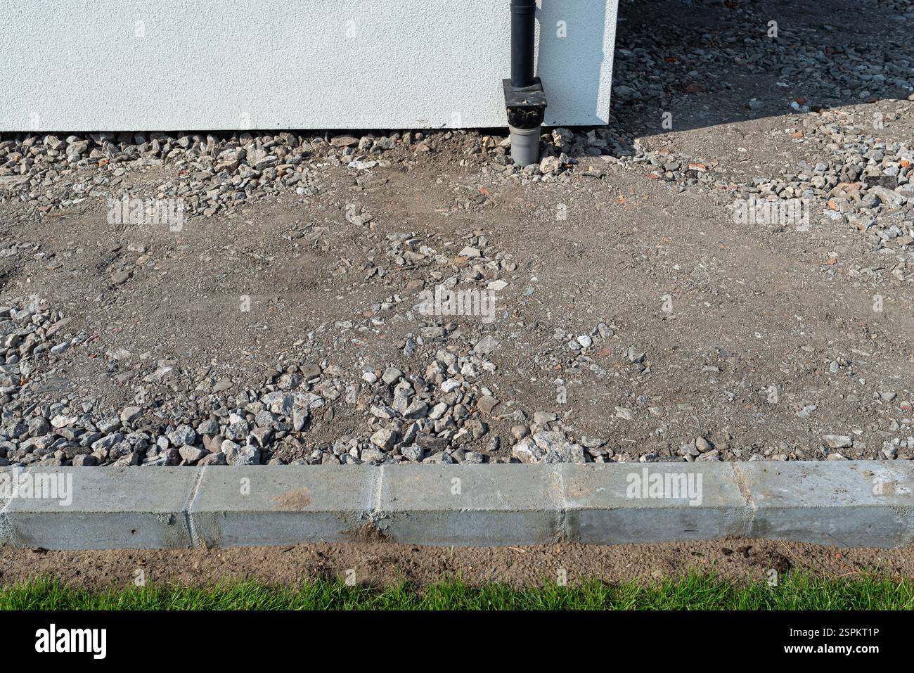 Compacting rubble on a terrace under construction using a gasoline ...