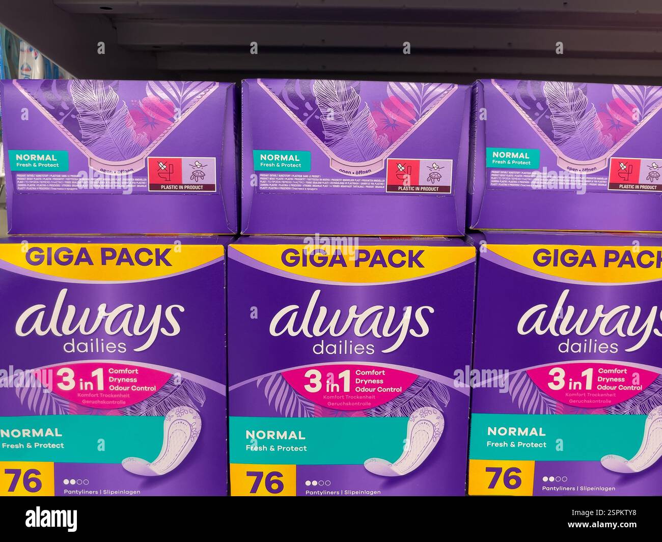 Three boxes of Always Dailies pantyliners are stacked two-by-three ...