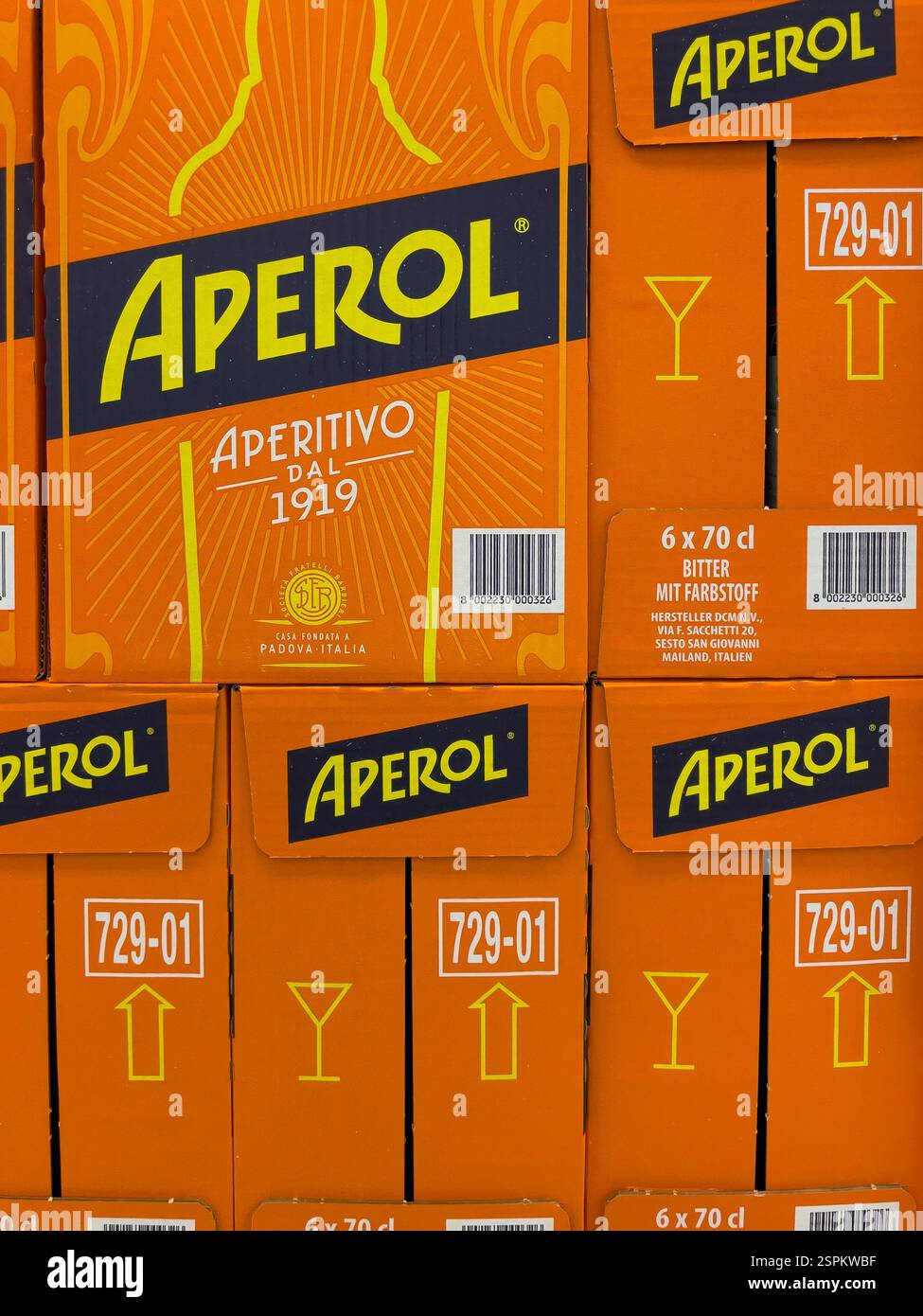 Close-up view of multiple orange Aperol boxes stacked. Each box ...