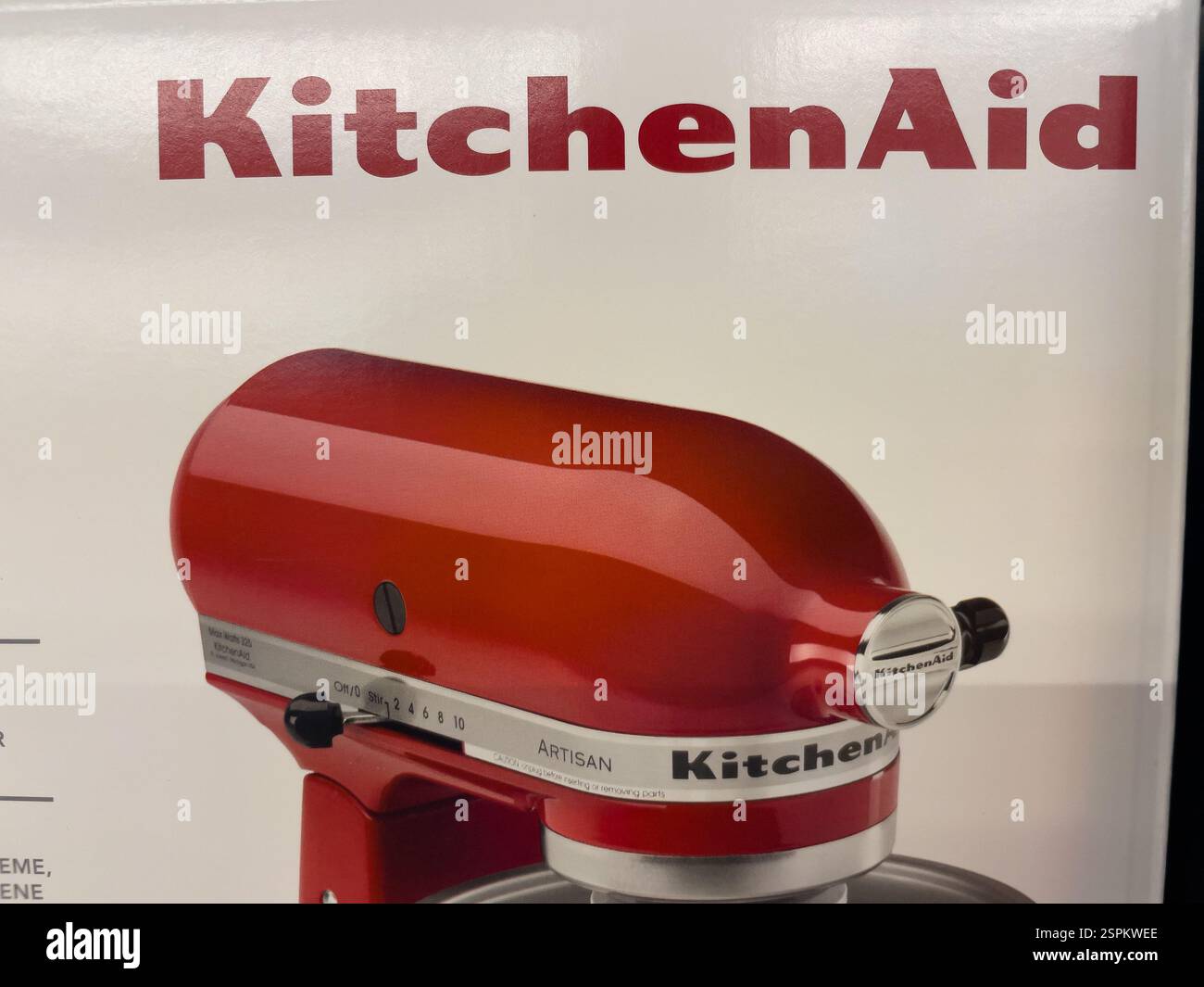 Close-up of a red KitchenAid Artisan stand mixer on a white background ...