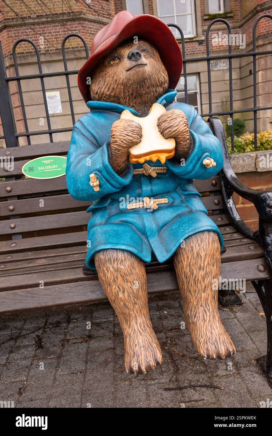 Paddington Bear sitting on a bench eating a marmalade sandwich on Fisherton Street, Salisbury ...