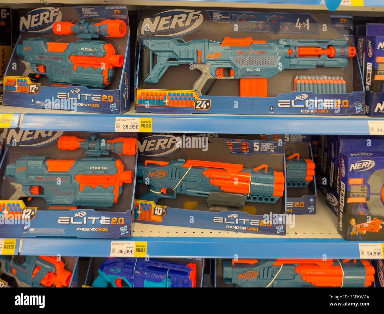 A retail shelf displays various Nerf Elite 2.0 toy blasters in their ...