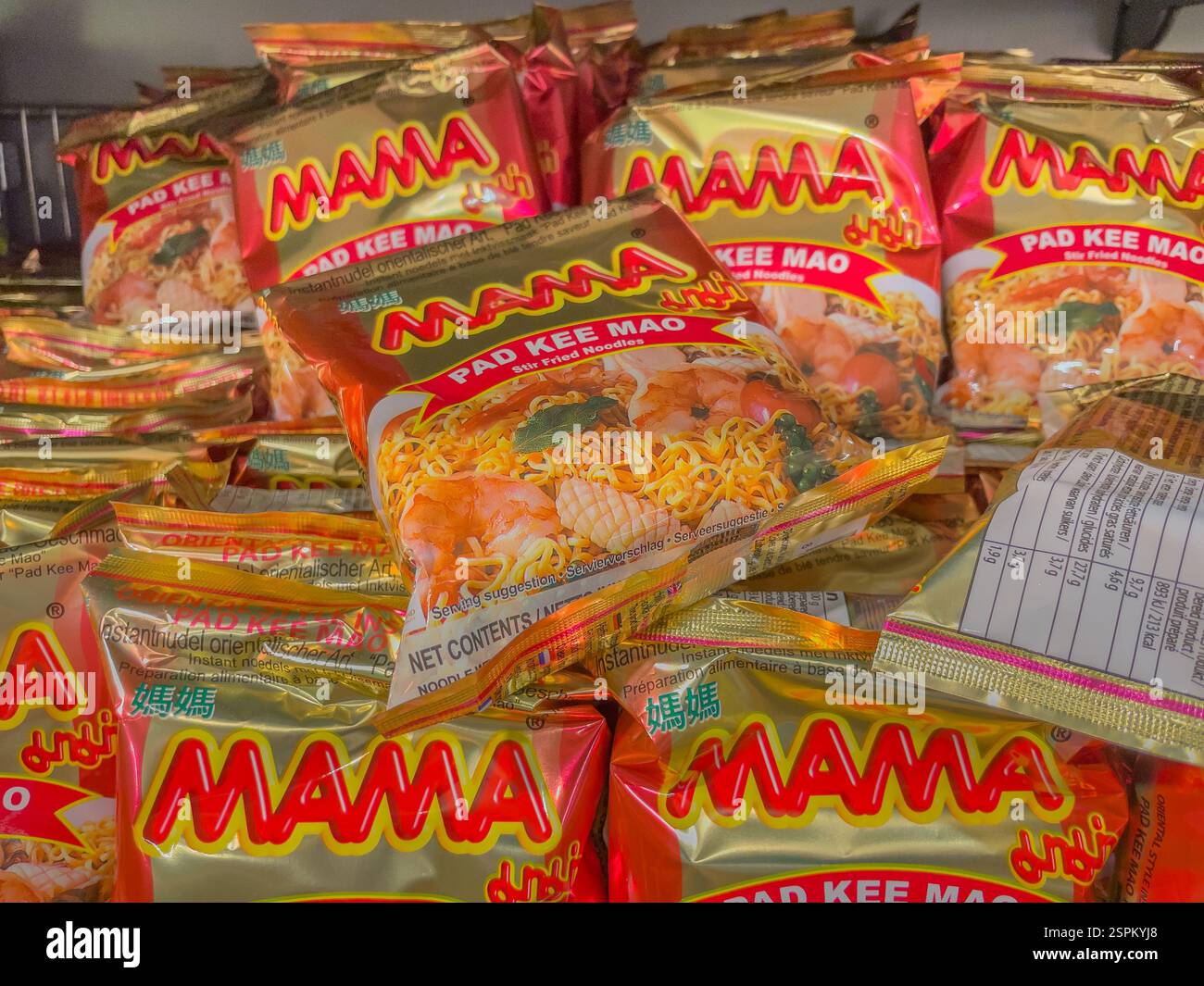 A close-up view of numerous packages of Mama Pad Kee Mao stir-fried ...