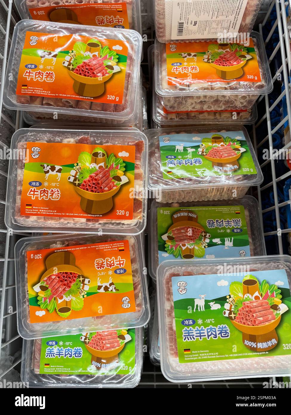 Several transparent plastic containers of frozen, pre-sliced beef and ...
