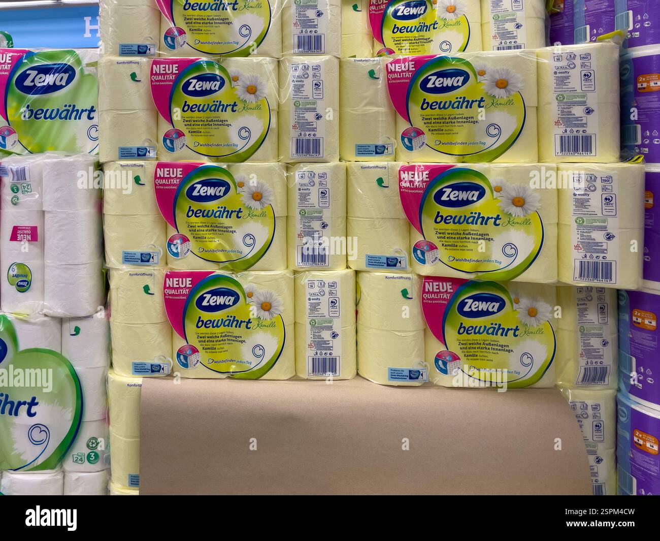 A stack of Zewa bewährst Kamille toilet paper packages, predominantly ...