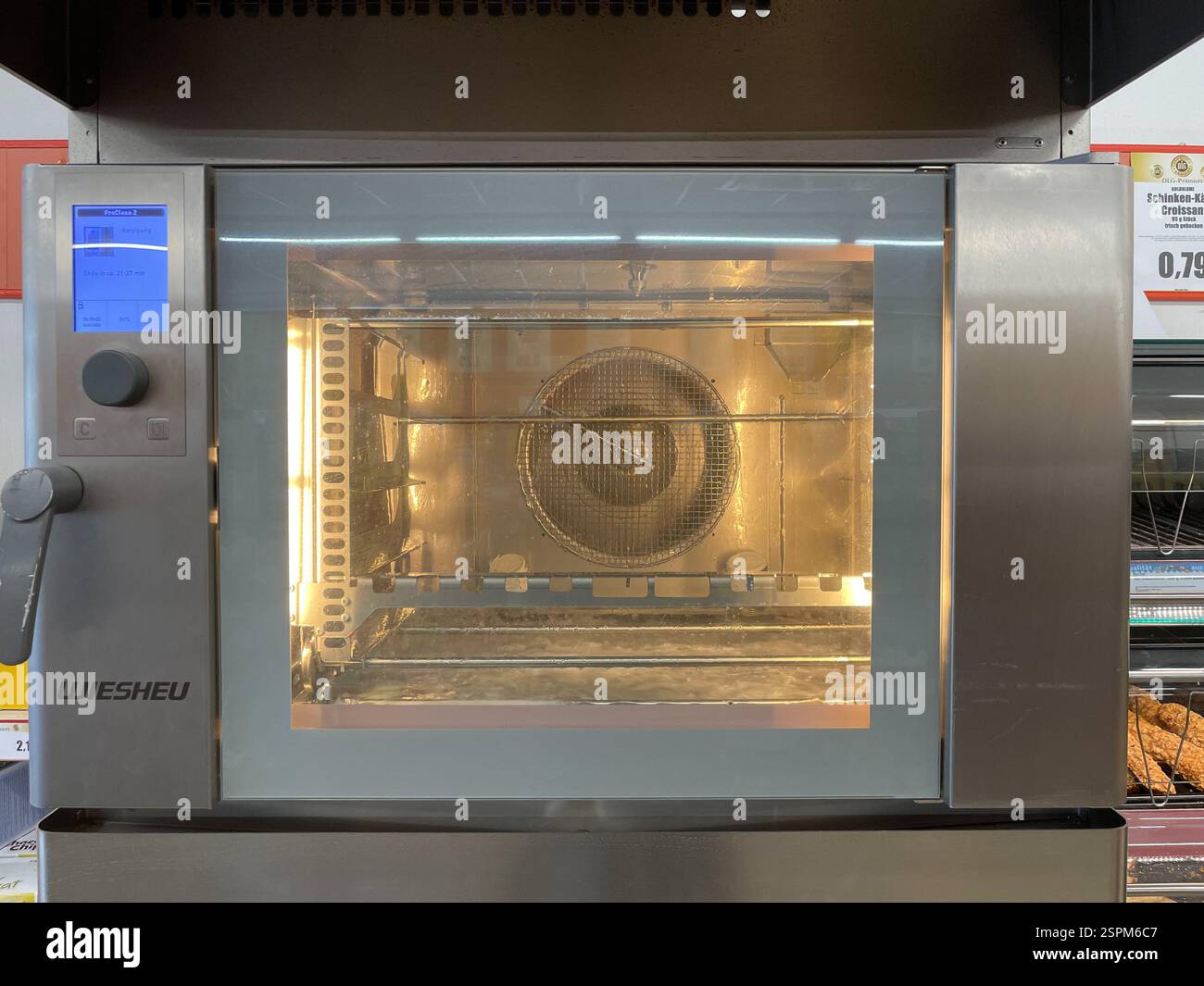 A stainless steel Wiesheu ProGlaze 3 combi oven is shown with its door ...