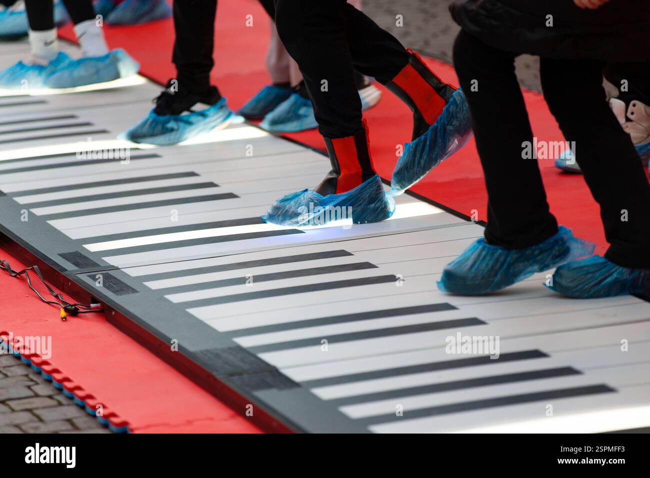 Italy, Children Play on the Giant Piano Keyboard Stock Photo - Alamy