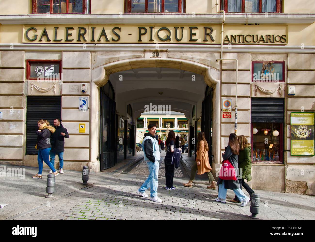 Entrance arch to Galerias Piquer Anticuarios antiques shop in a square ...