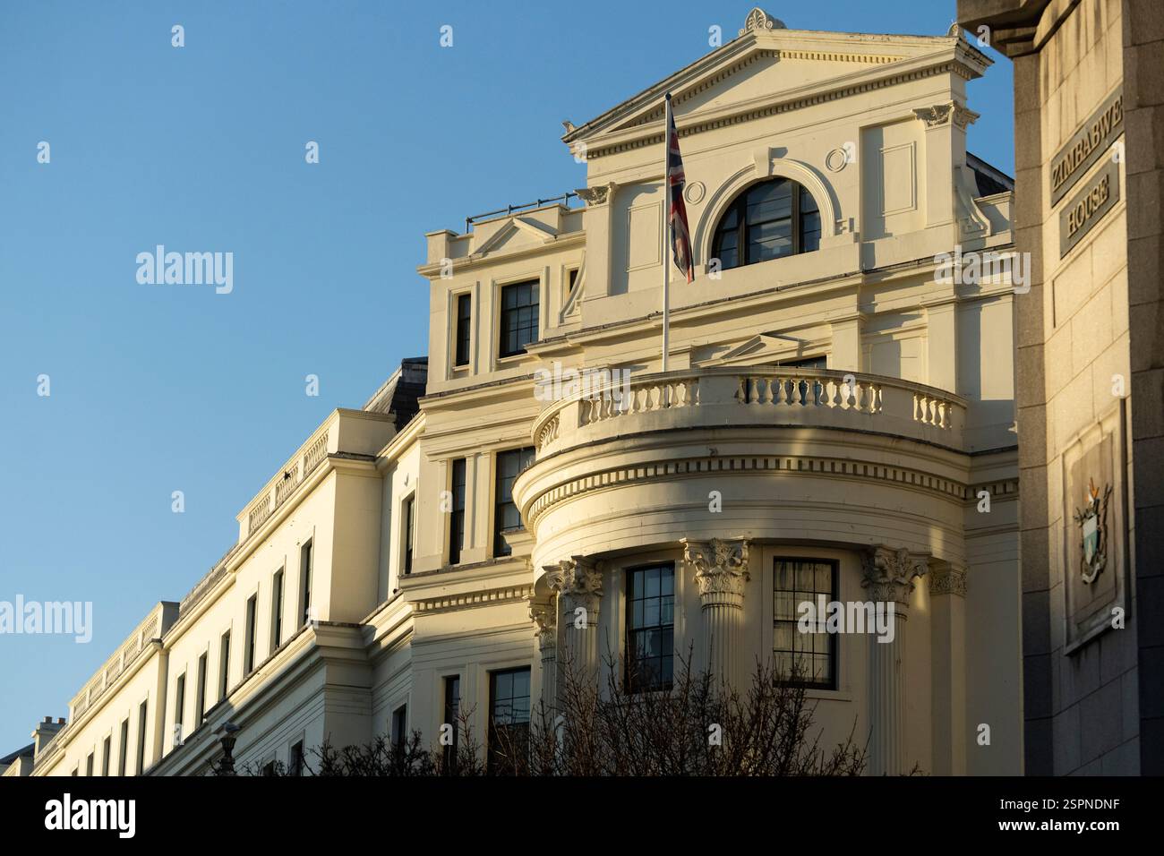 Zimbabwe House, London, UK. A stately building with the UK flag flying ...