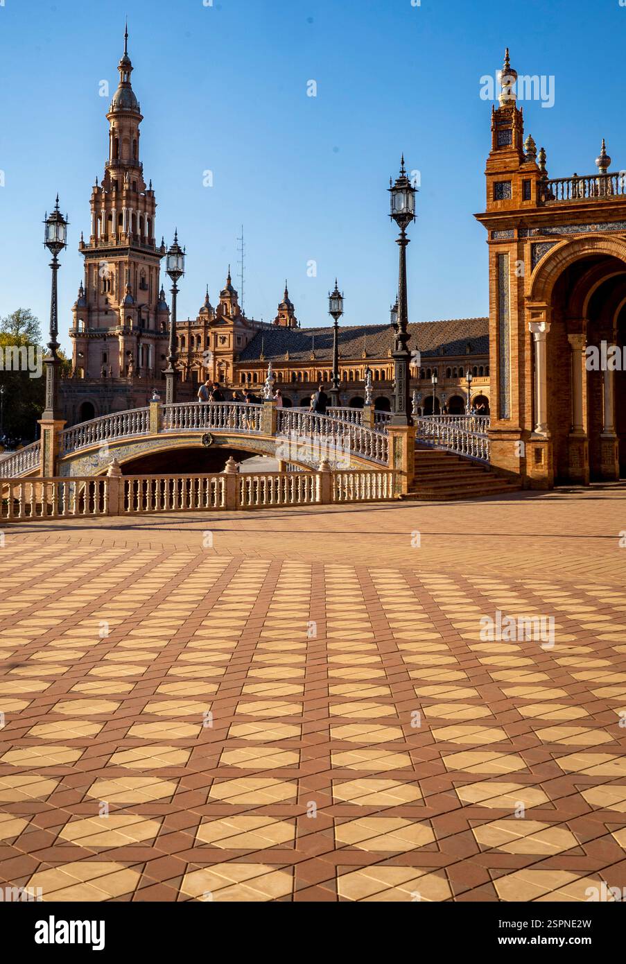 A scenic view of a plaza featuring intricate tiled flooring, ornate ...