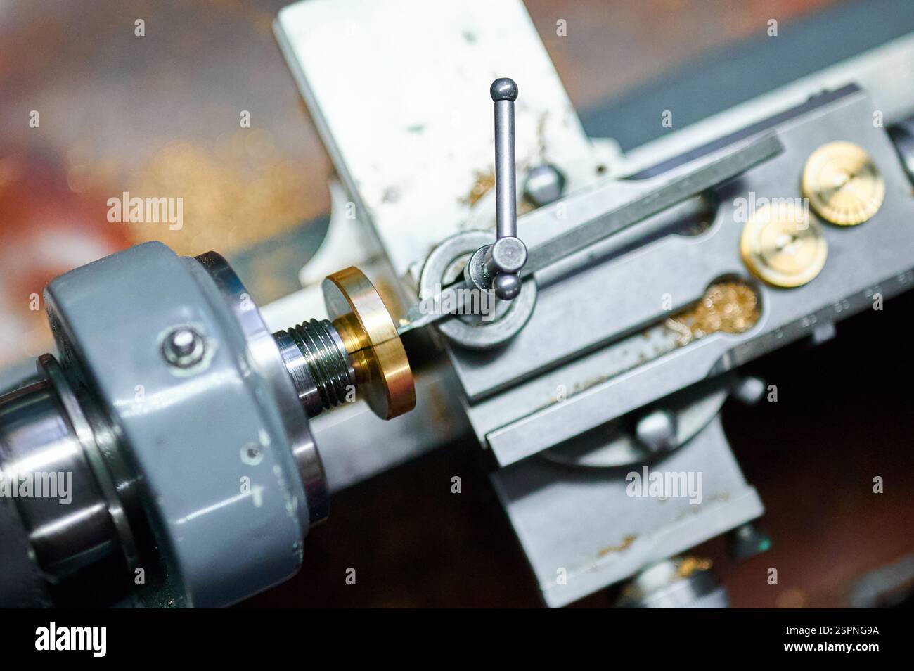 Precision shaping of metal on a small-sized lathe in a workshop ...