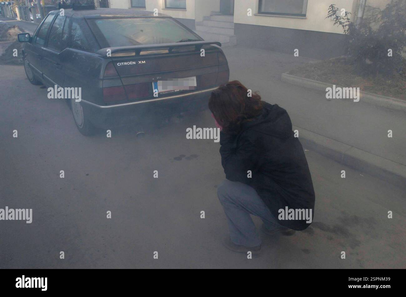 Air pollution and particulates caused by car exhaust gases, cloud of ...