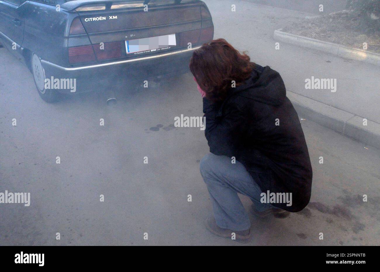 Air pollution and particulates caused by car exhaust gases, cloud of ...