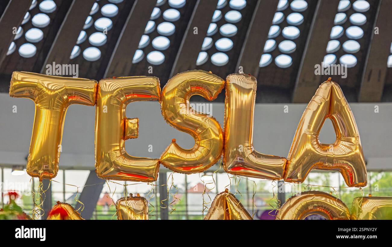 Golden Foil Helium Balloons Letters Tesla Sign in Hall Stock Photo - Alamy