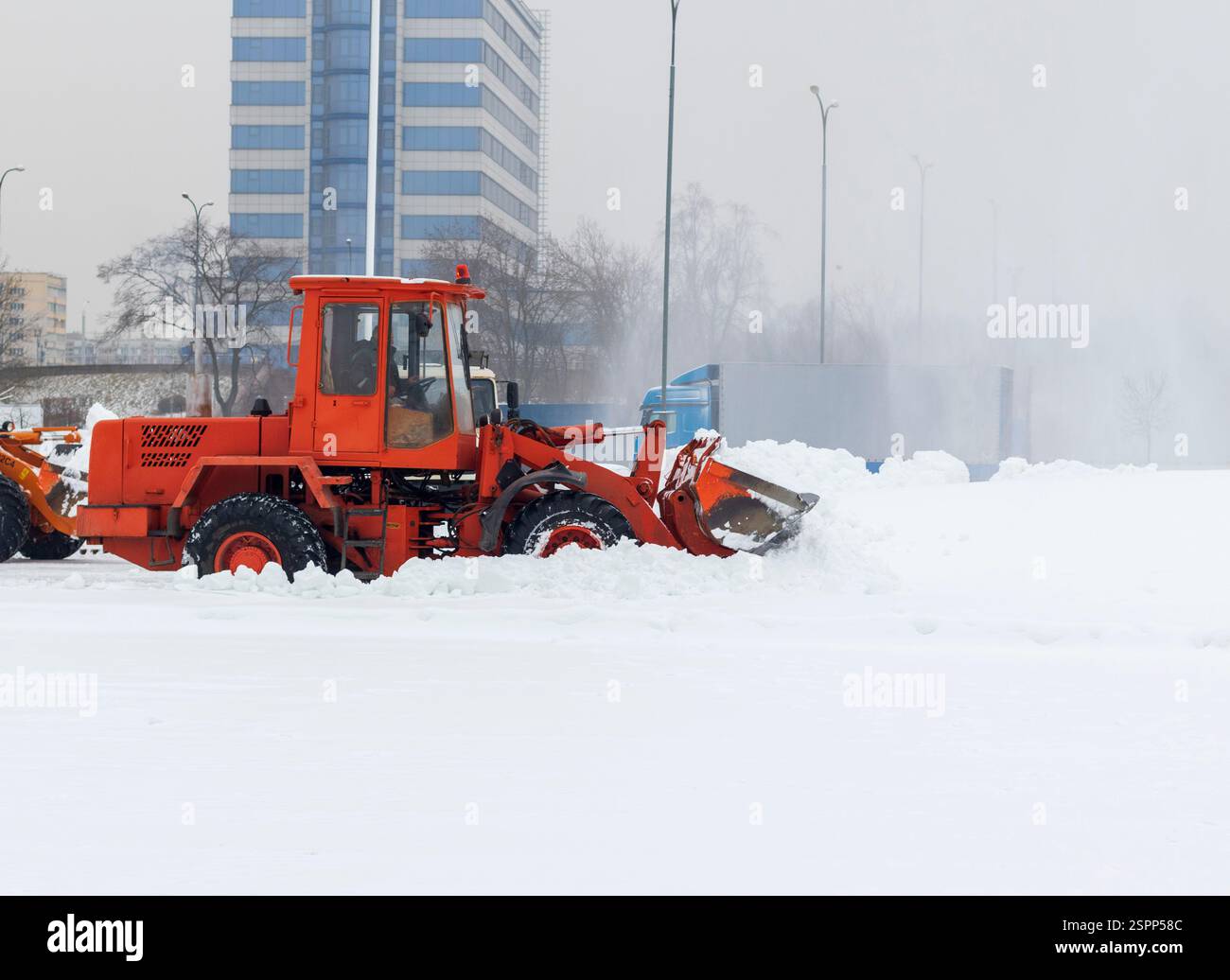 Heavy machinery cleaning the snow after heavy snowfall Stock Photo - Alamy
