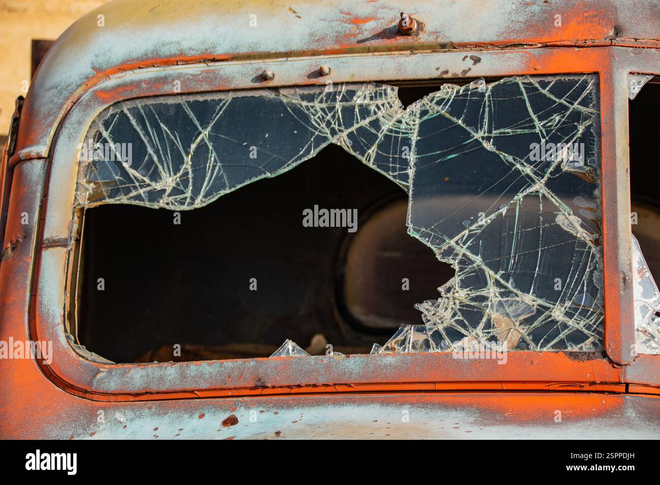 Broken windshield glass in an old abandoned truck. Split windshield in ...