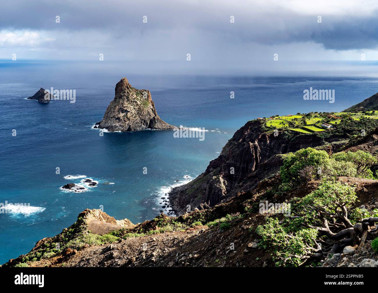 A scenic coastal view featuring rocky cliffs and islands in the ocean ...