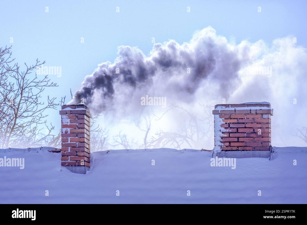 Smoke coming out of a chimney in winter, causing air pollution and smog ...