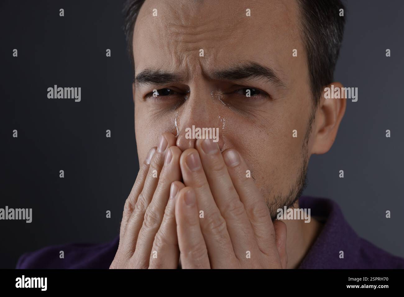 Sad man crying on grey background, closeup Stock Photo - Alamy