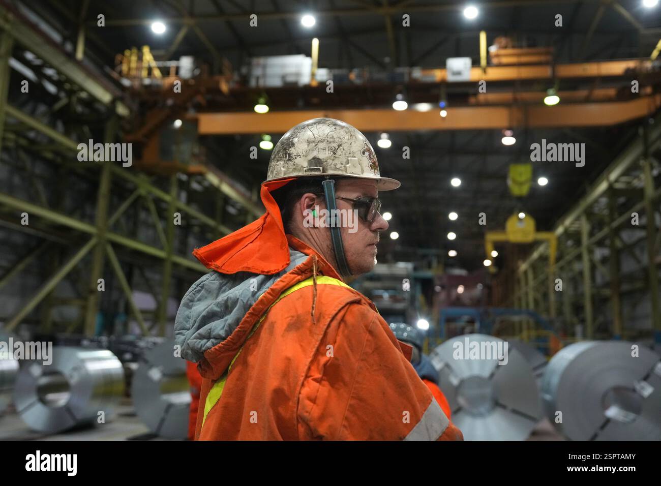A steelworker is seen at the ArcelorMittal Dofasco Steel Plant in ...