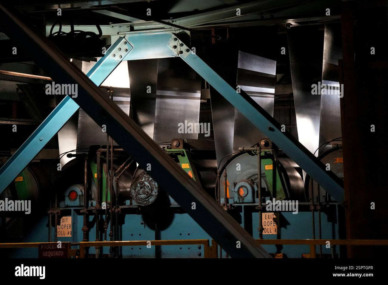 Sheets of steel pass through a galvanizing process at the ArcelorMittal ...