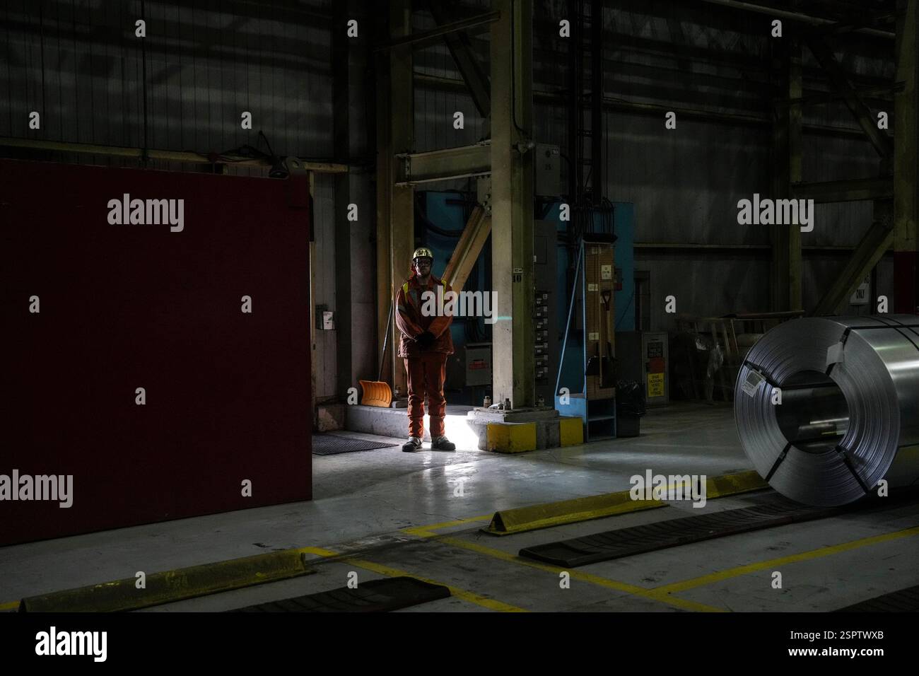 A steelworker is seen at the ArcelorMittal Dofasco Steel Plant in ...