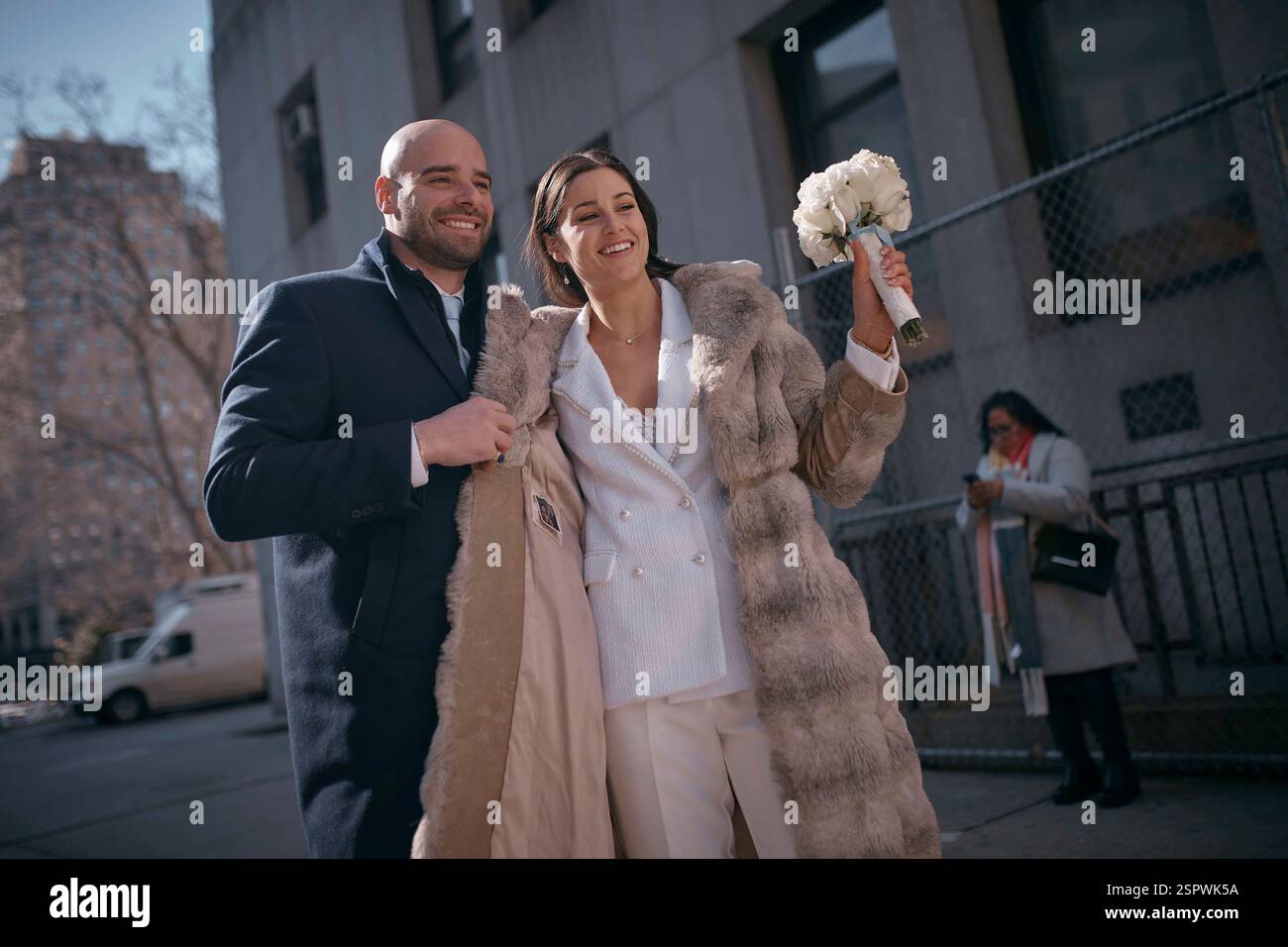 A couple poses for a picture after getting married on Valentine's Day ...