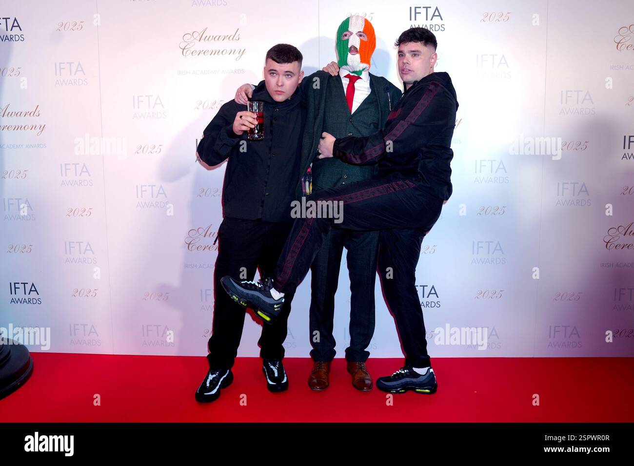 (left to right) members of Kneecap, Mo Chara, JJ O'Dochartaigh and ...