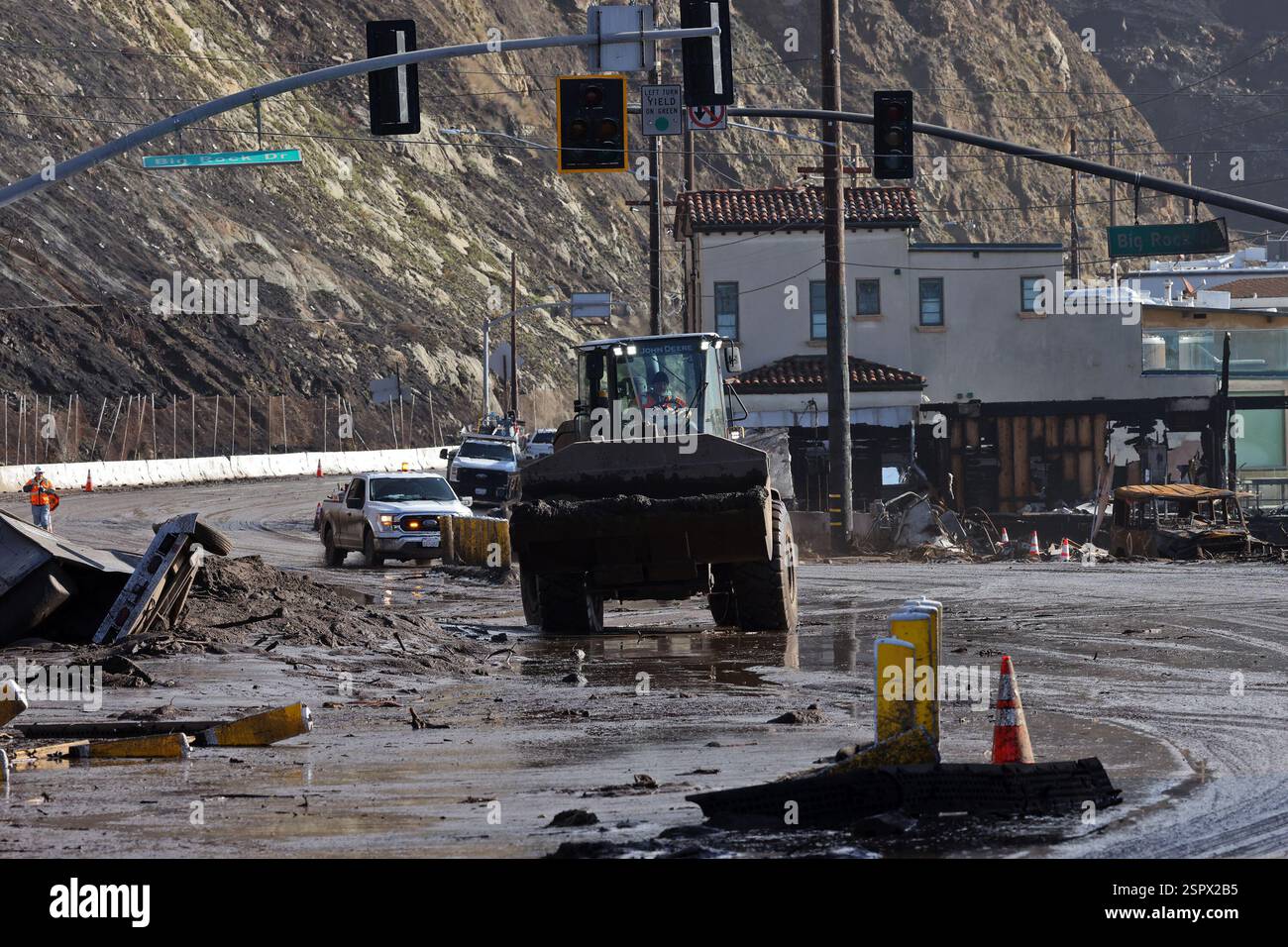 Malibu, California, USA. 14th Feb, 2025. Crews work on cleaning up from ...