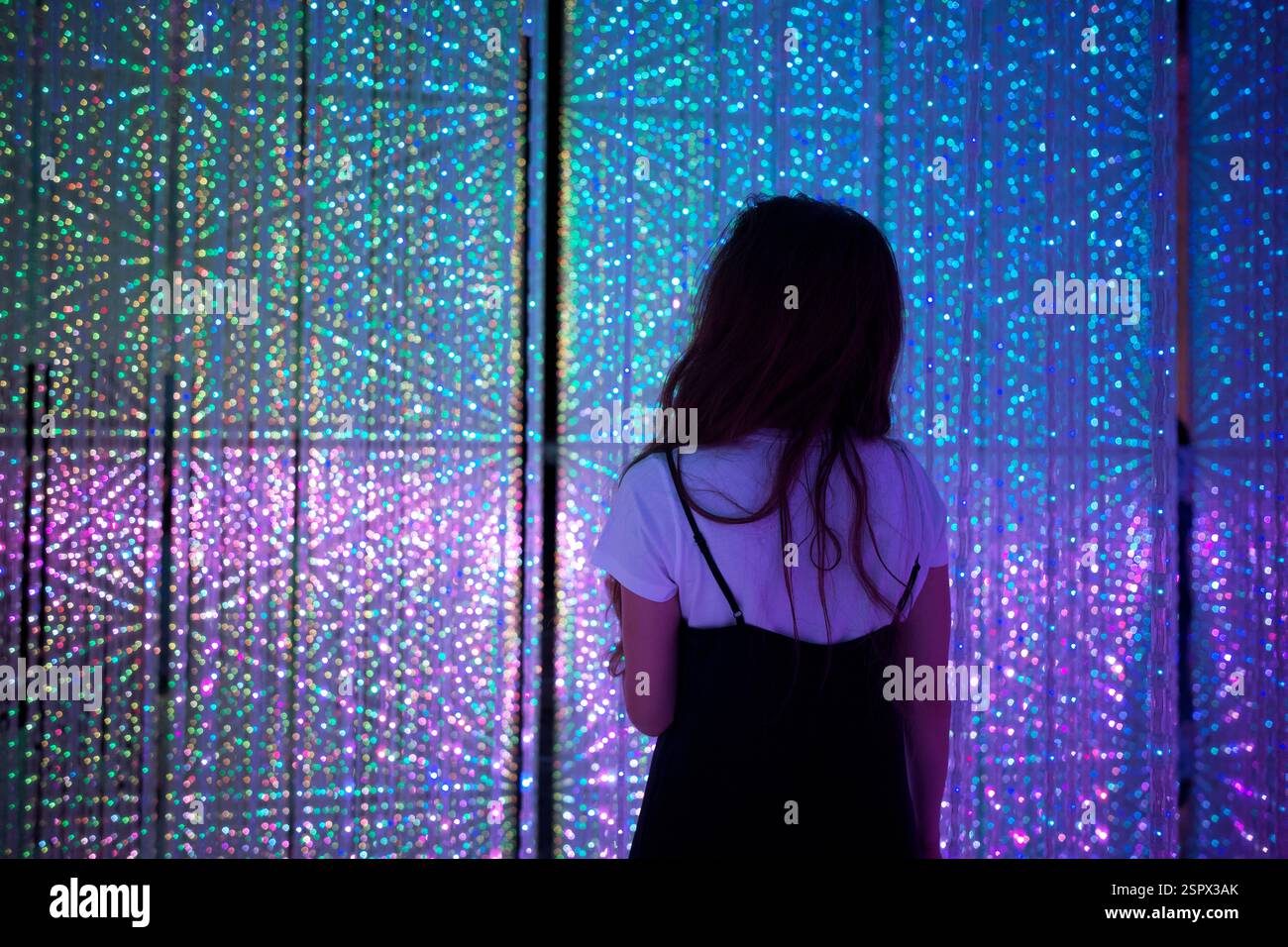 Woman in immersive light exhibit at TeamLab Tokyo Stock Photo - Alamy