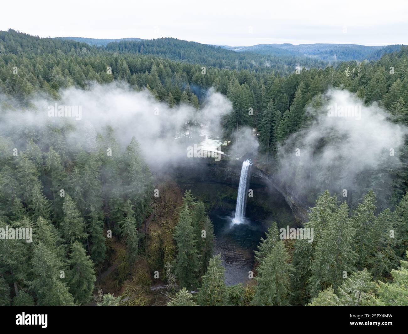 Mist drifts above the magnificent South Falls in Oregon. The entire ...