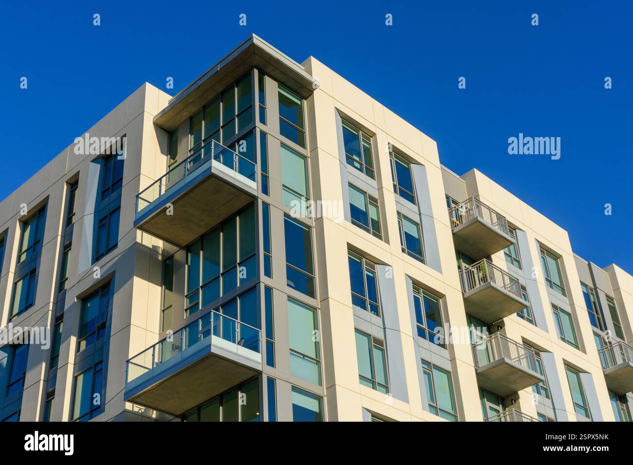 Exterior view of upscale modern luxury apartment building with floor to ...