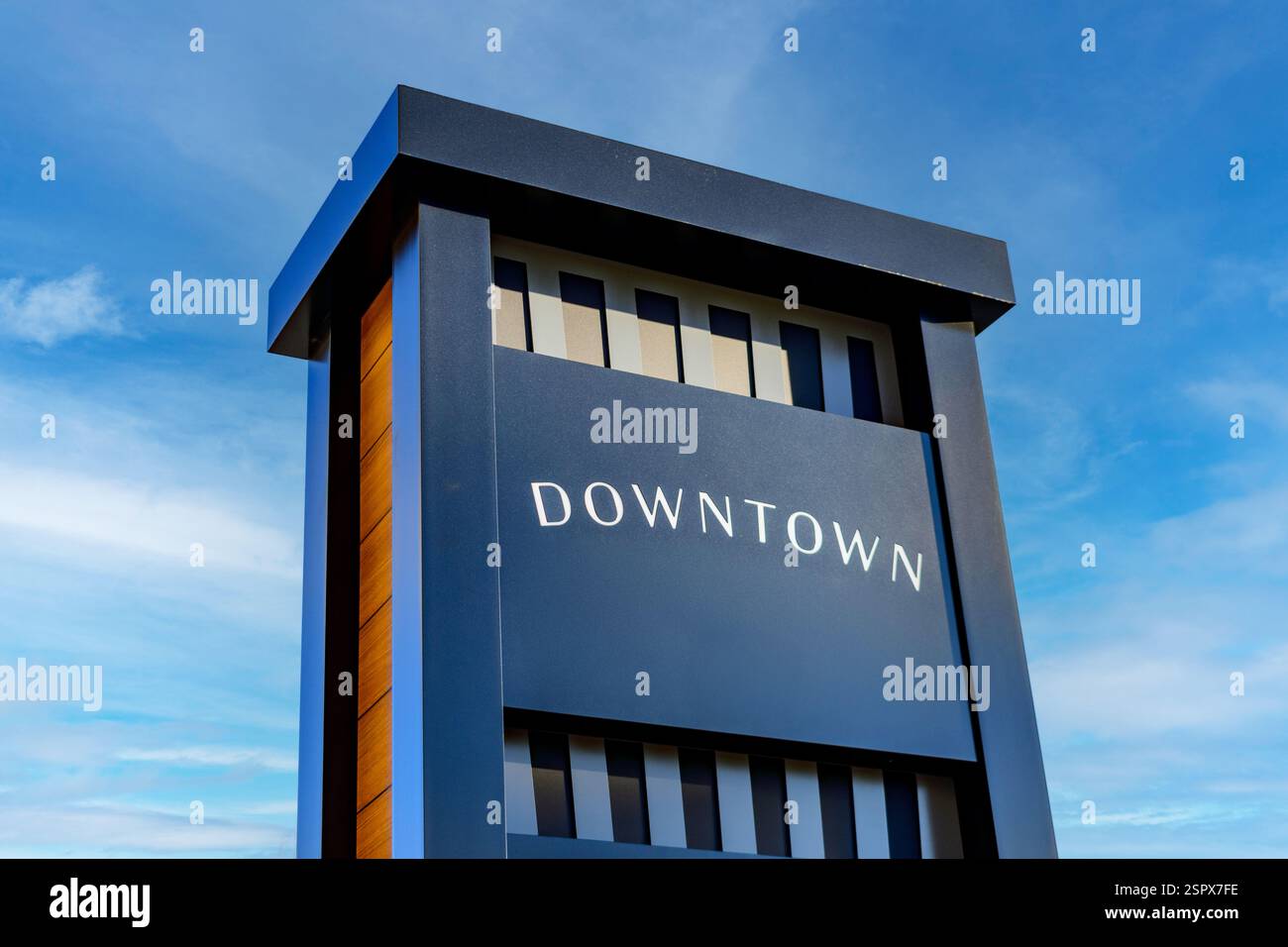Modern downtown signage featuring white lettering against a dark gray ...