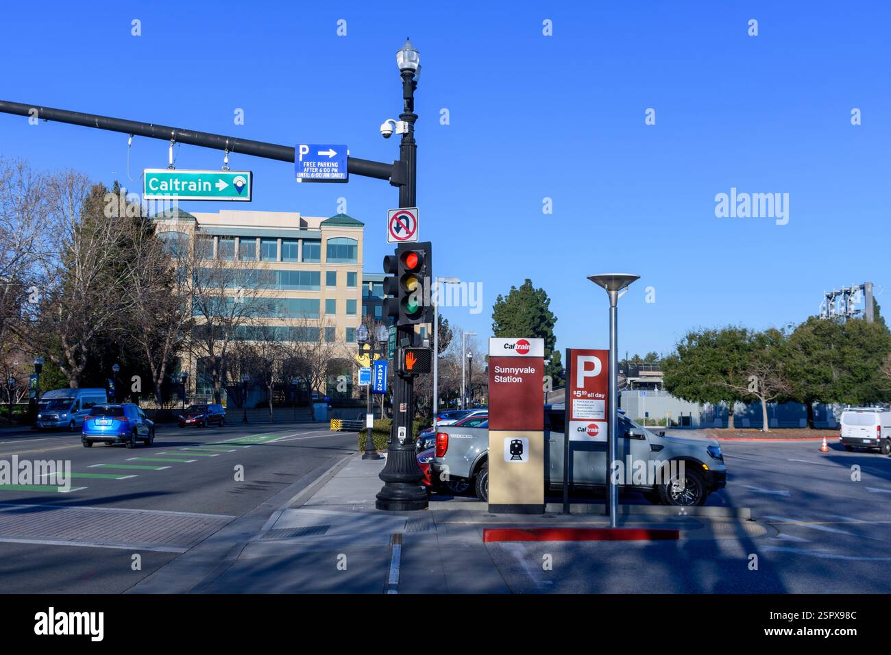 A daytime view of Sunnyvale Caltrain Station with signage, traffic ...