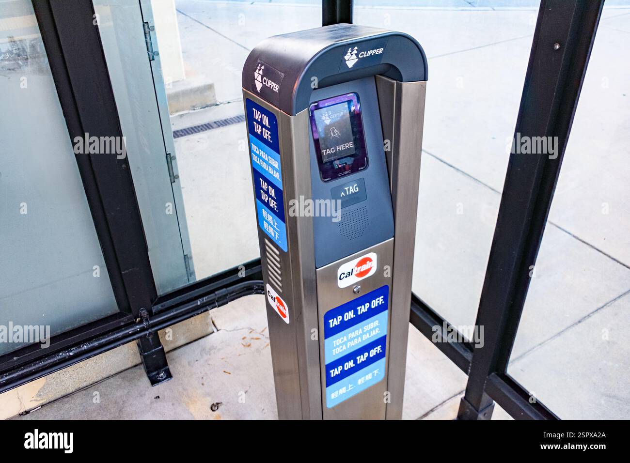 Modern Clipper card reader at a Caltrain station. A transit fare ...