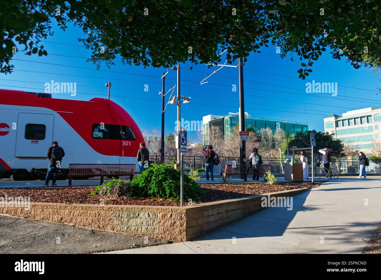 Caltrain electric train at Sunnyvale downtown station with commuters ...