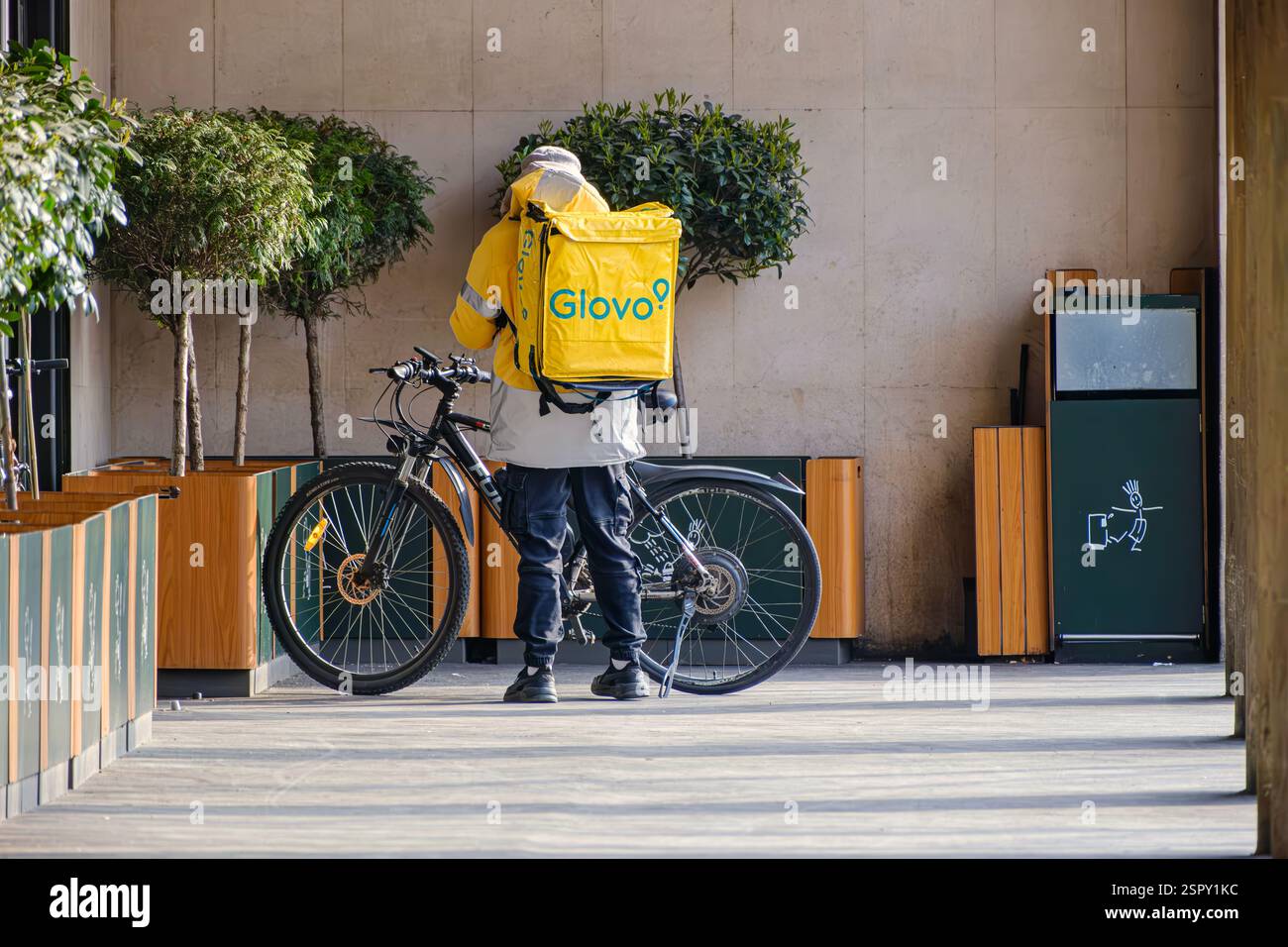 Glovo employee taking the order from McDonalds Stock Photo - Alamy