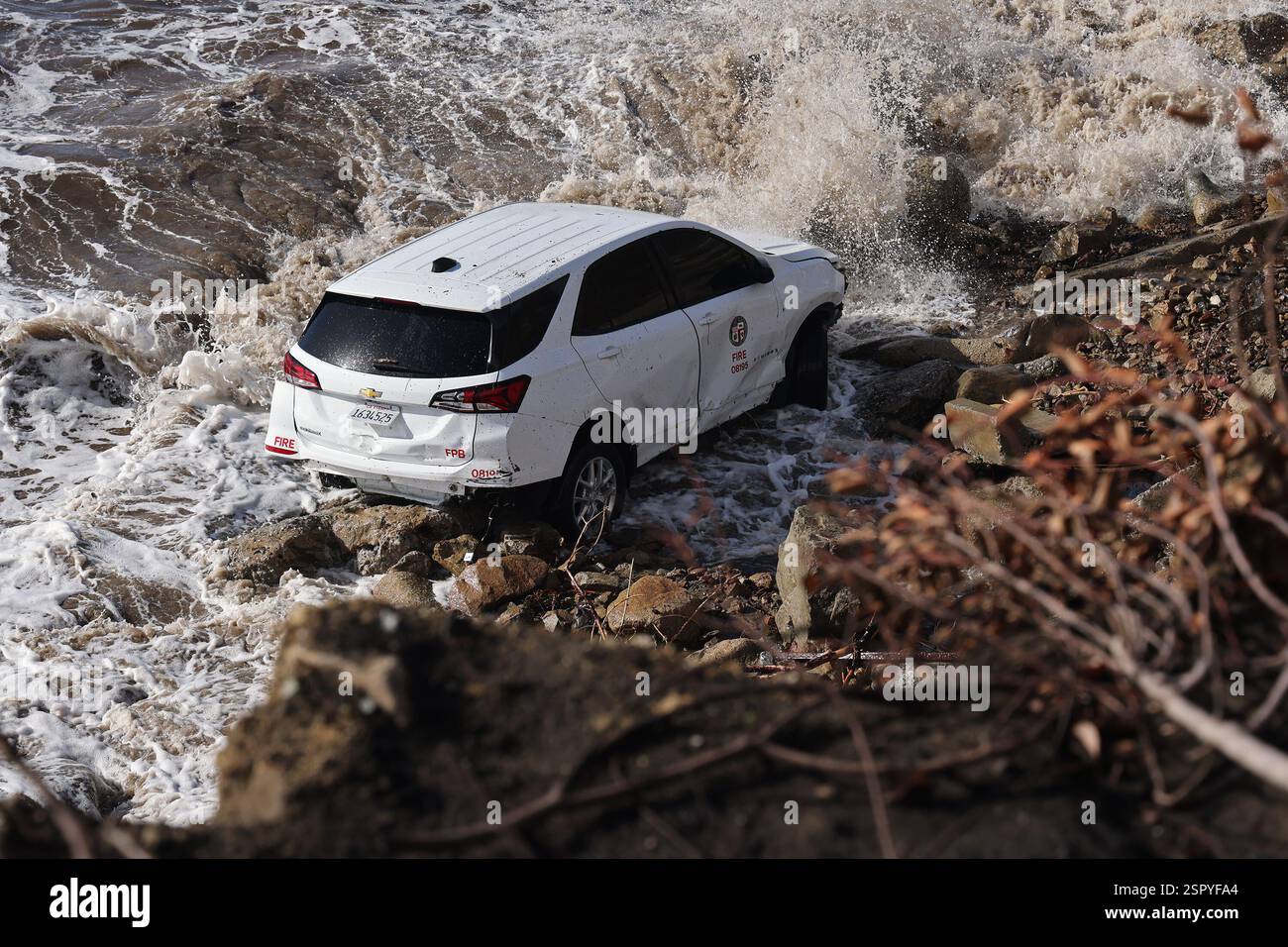 Malibu, California, USA. 14th Feb, 2025. A damaged white Los Angeles Fire Department SUV was ...