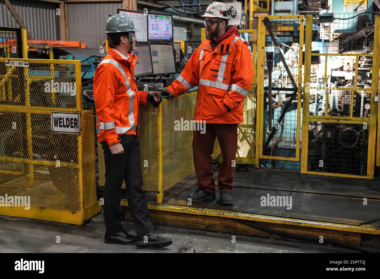Prime Minister Justin Trudeau talks to a steelworker as he visits the ...