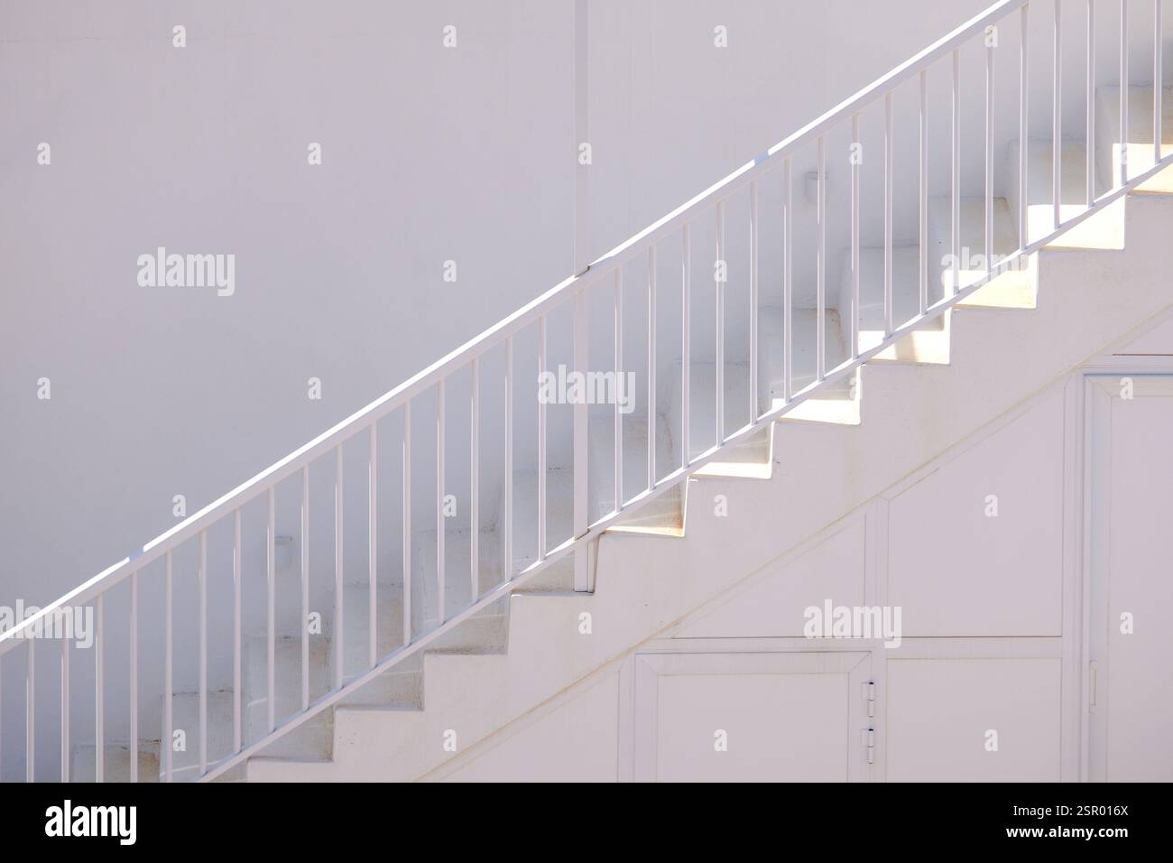 White stairs with stone wall Stock Photo - Alamy