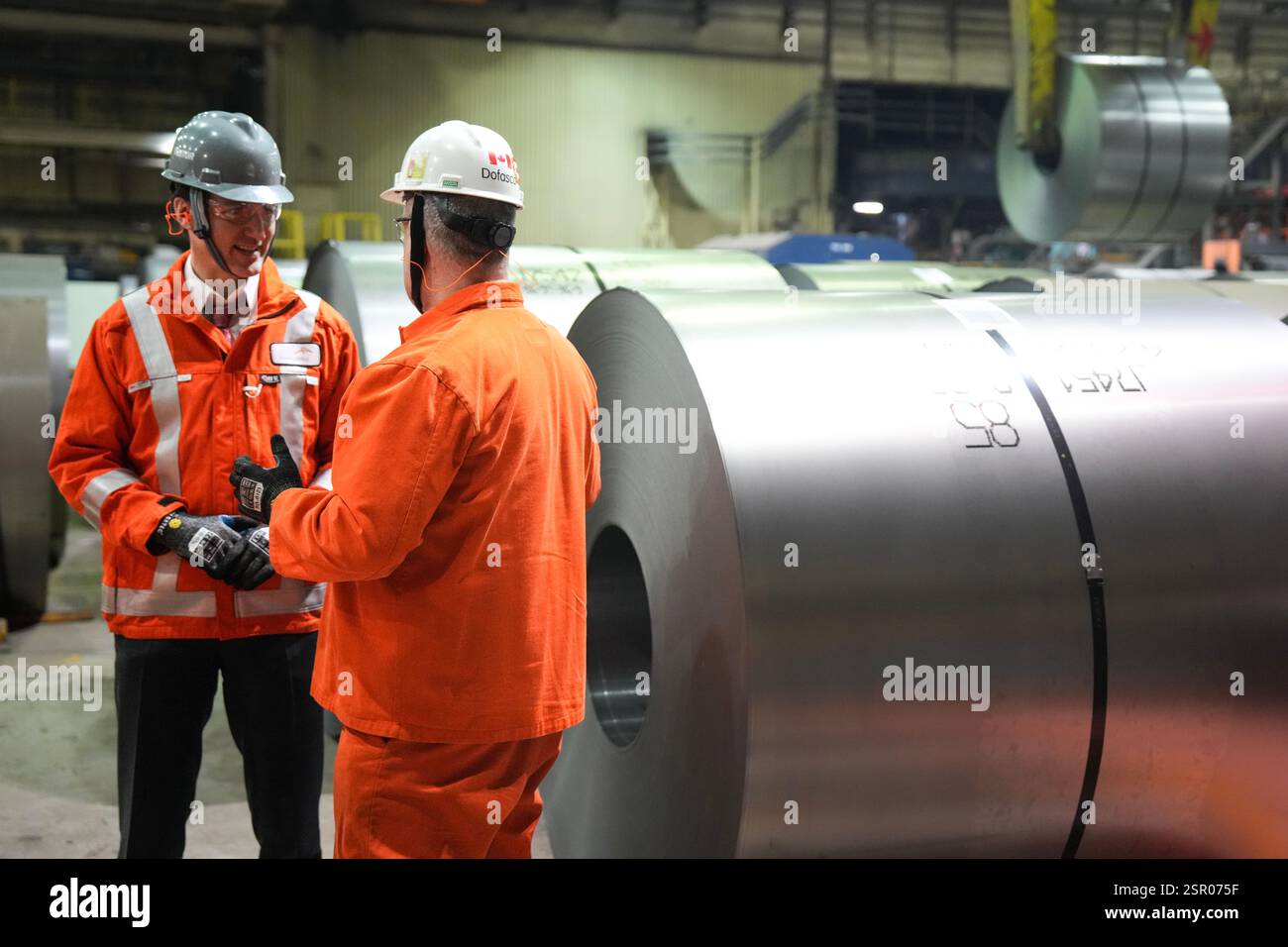 Prime Minister Justin Trudeau greets a steelworker as he visits the ArcelorMittal Dofasco Steel ...