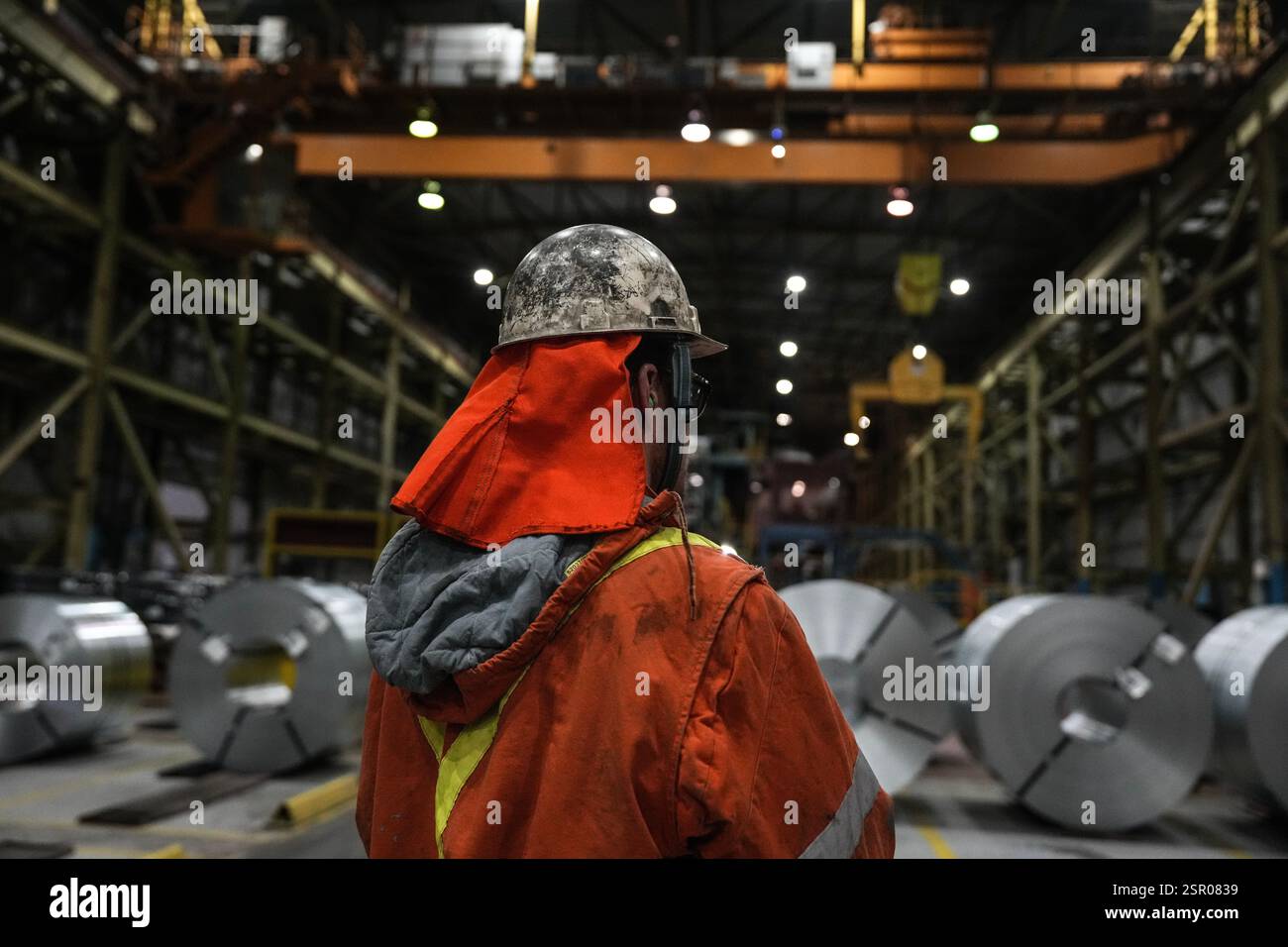A steelworker is seen at the ArcelorMittal Dofasco Steel Plant in ...