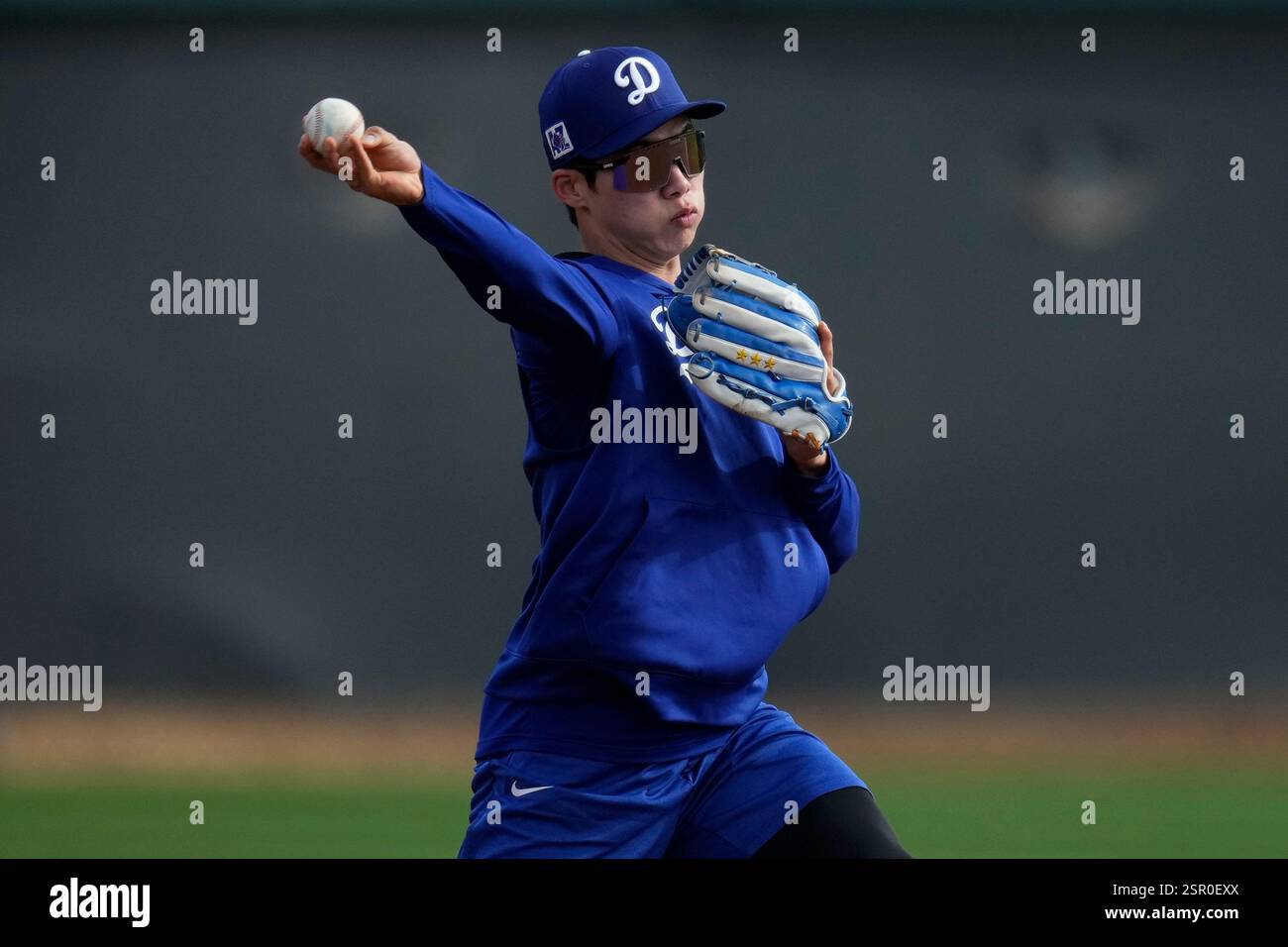 Los Angeles Dodgers' Hyeseong Kim runs drills during a baseball spring ...