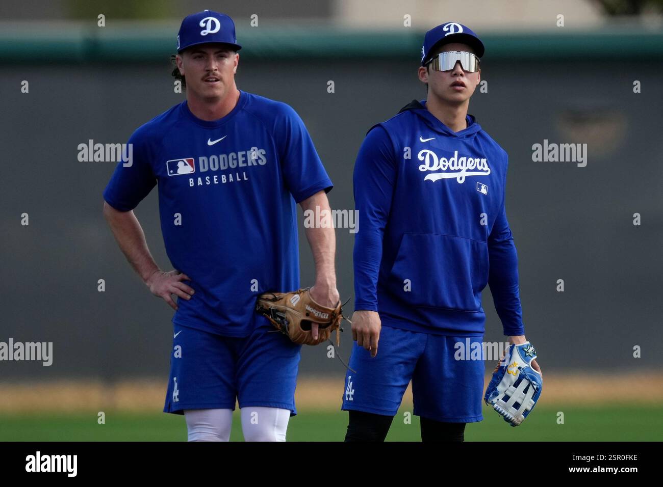 Los Angeles Dodgers' Hyeseong Kim, right, and Austin Gauthier run drills during a baseball ...