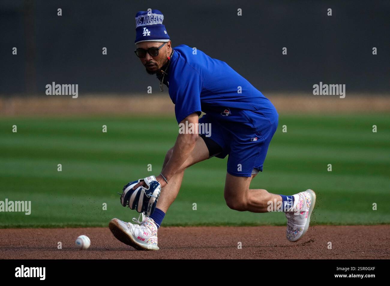 Los Angeles Dodgers' Mookie Betts runs drills during a baseball spring ...
