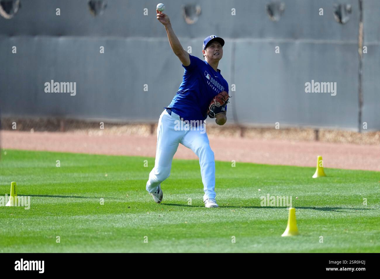 Los Angeles Dodgers' Shohei Ohtani, of Japan, runs drills during a ...