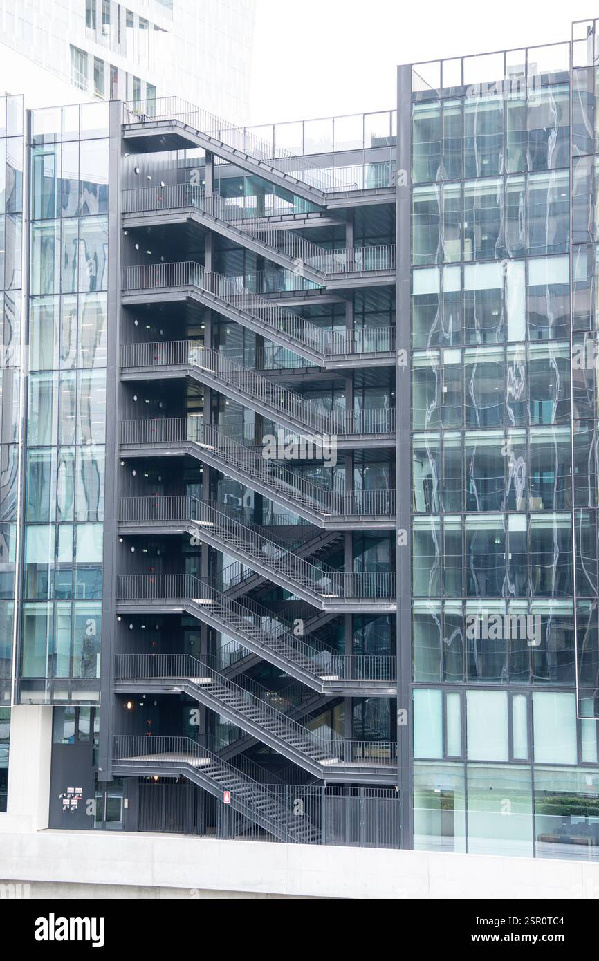 Modern design features a striking black staircase in an urban space ...