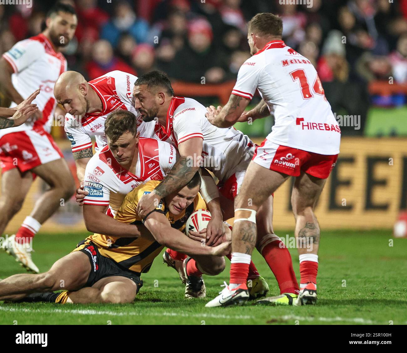 Innes Senior of Castleford Tigers is tackled by Elliot Minchella of ...