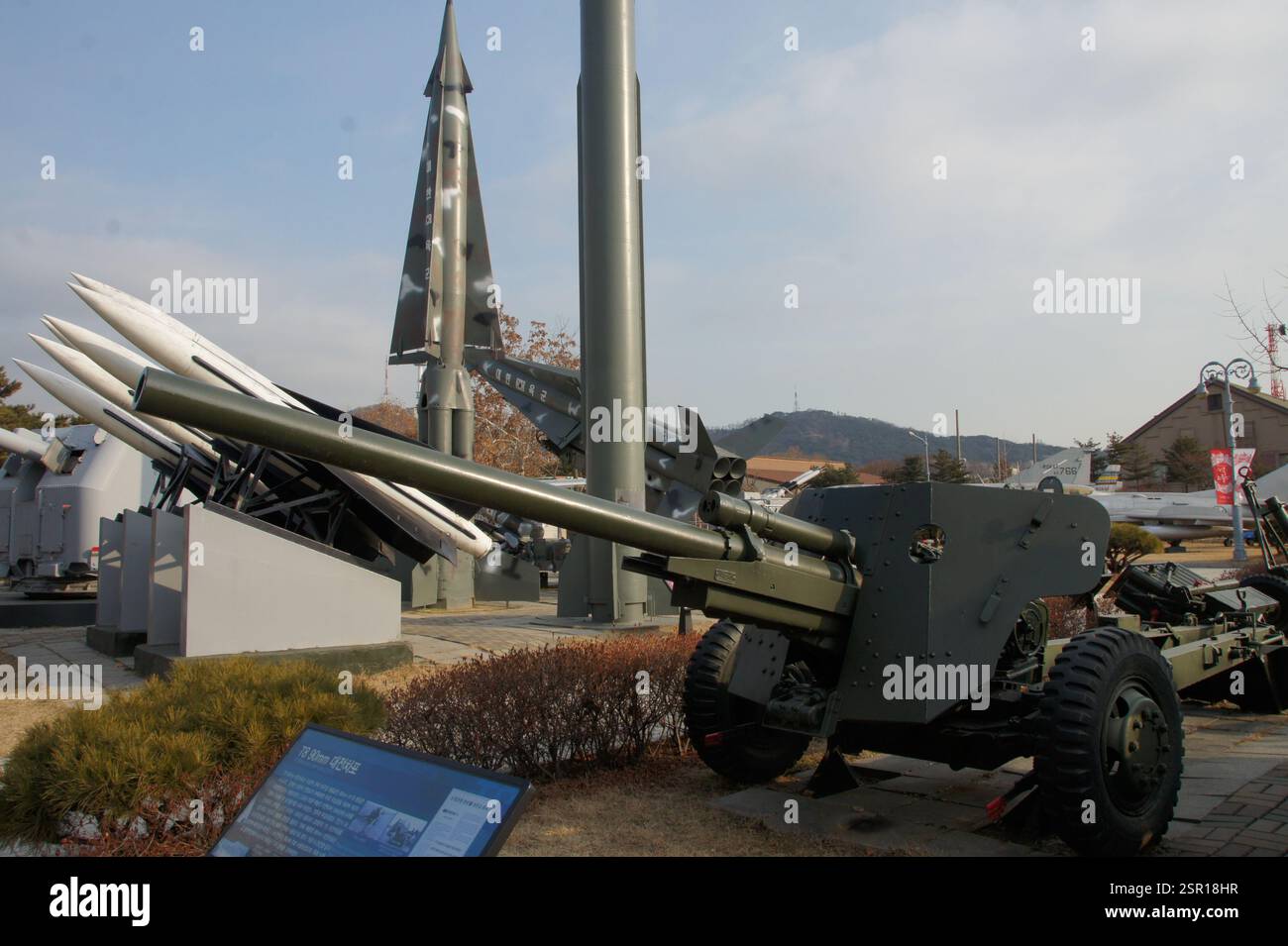 Military equipment on display. Various missiles and artillery pieces ...